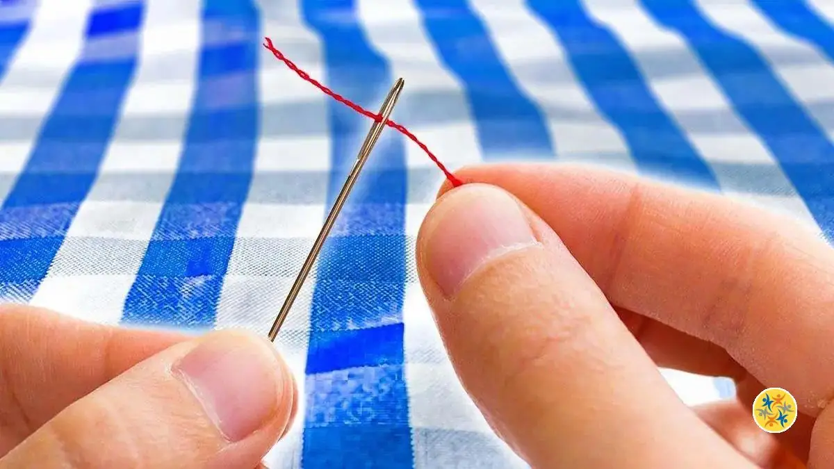 Enfiler un Fil dans une Aiguille: La Technique des Couturiers